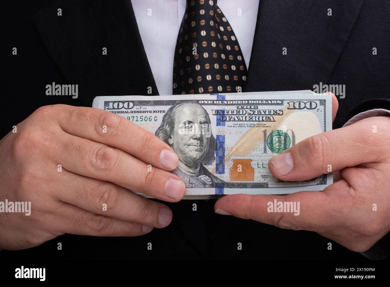 Hands holding USD dollar banknotes currencies as financial activity ...