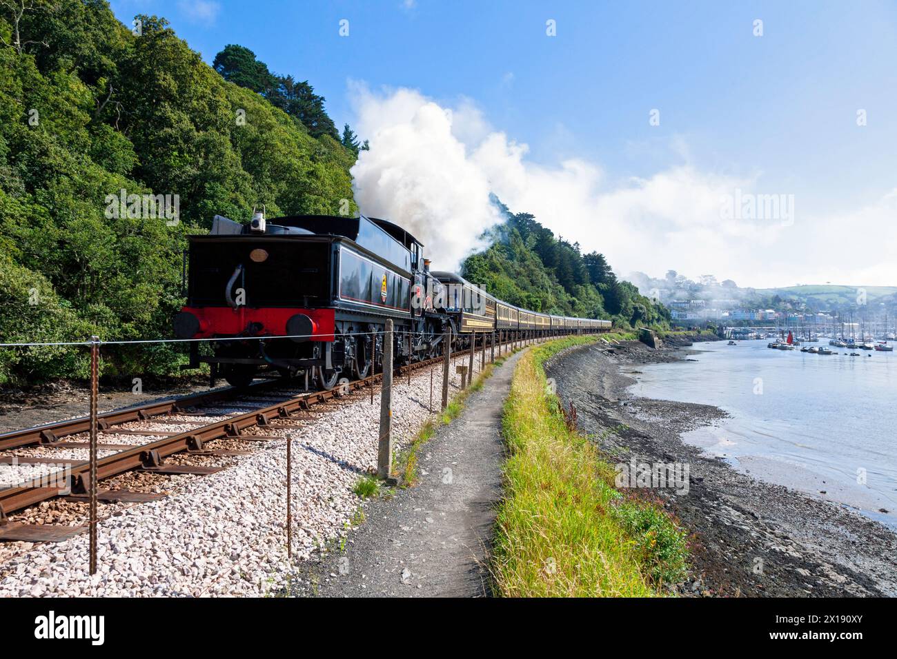 England, Devon, GWR Steam Locomotive No. 7827 'Lydham Manor' departing ...