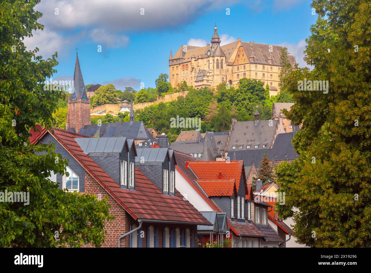 Traditional timber-framed houses line the cobblestone street leading to ...