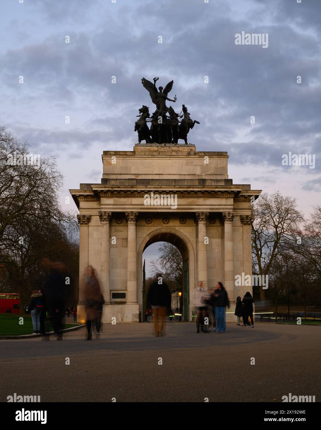 Shadows of people passing the Wellington Arch in London in the evening ...