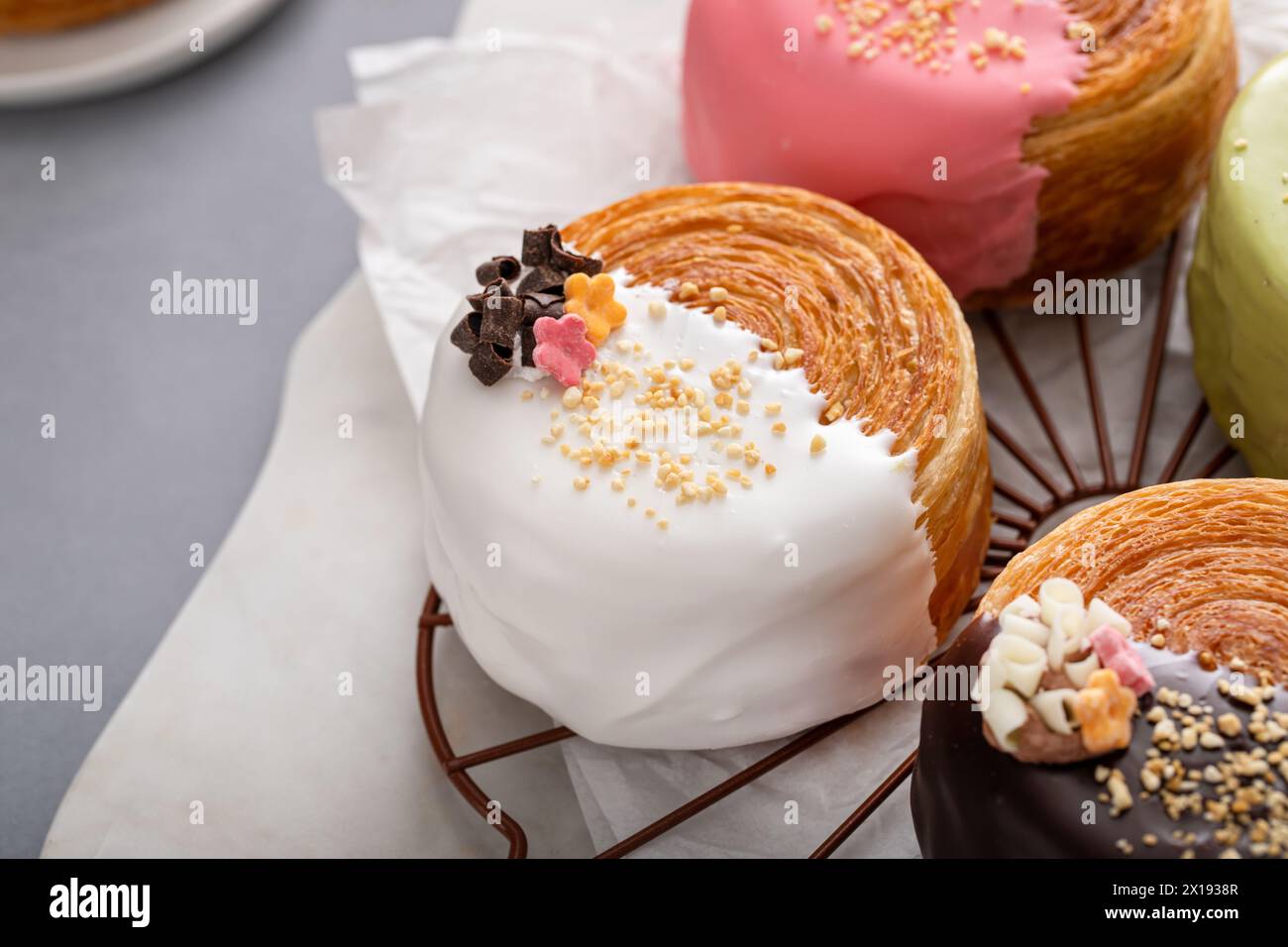 Round croissants with filling and glaze, trendy dessert idea, closeup ...
