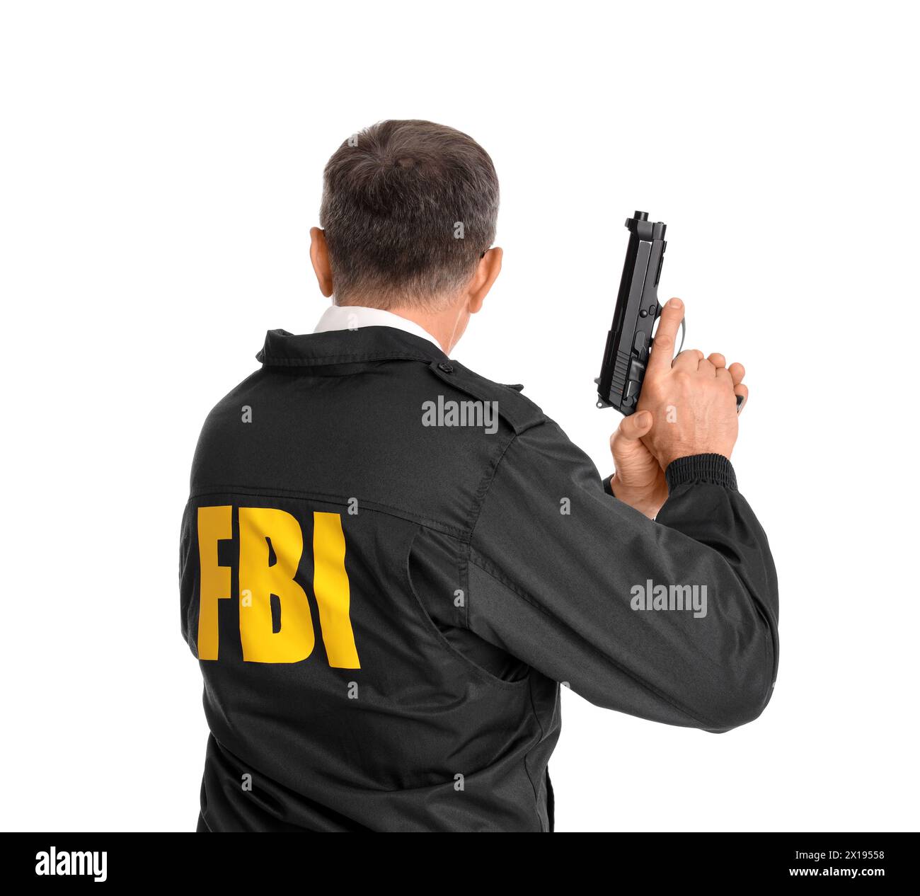 Mature FBI agent with gun on white background, back view Stock Photo ...