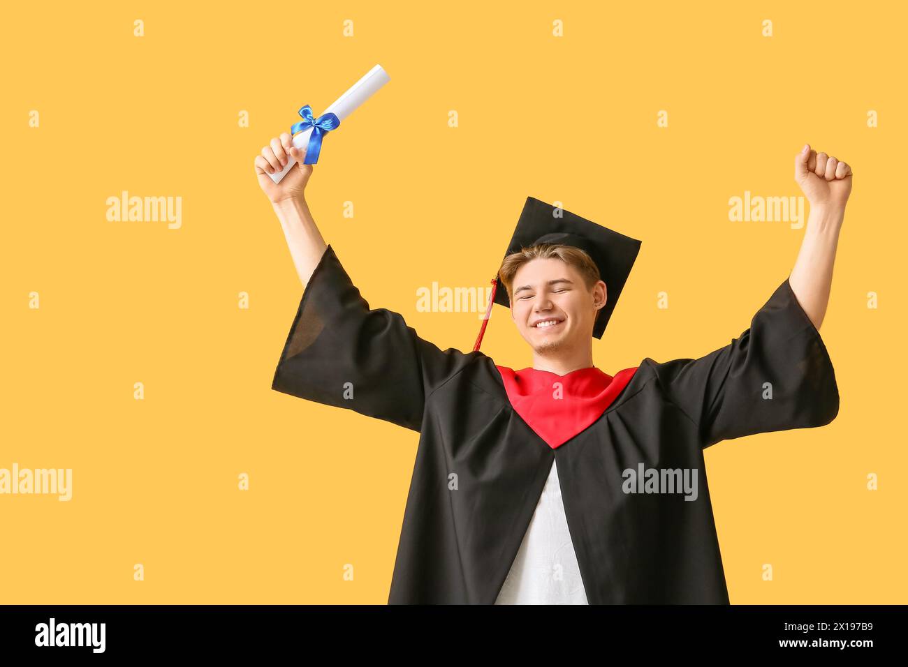 Happy male graduate with diploma on yellow background Stock Photo - Alamy