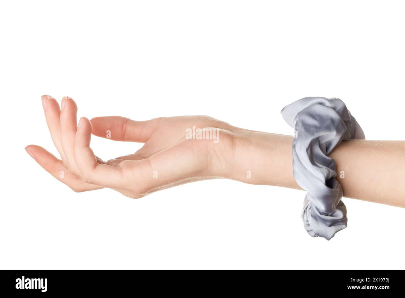 Female hand with trendy silk scrunchy on white background Stock Photo ...