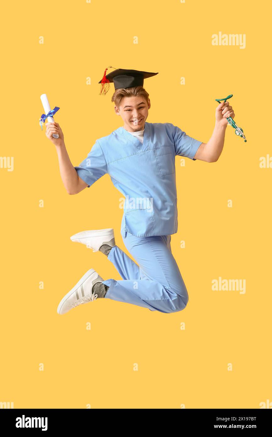 Happy male medical graduate student with diploma and stethoscope ...