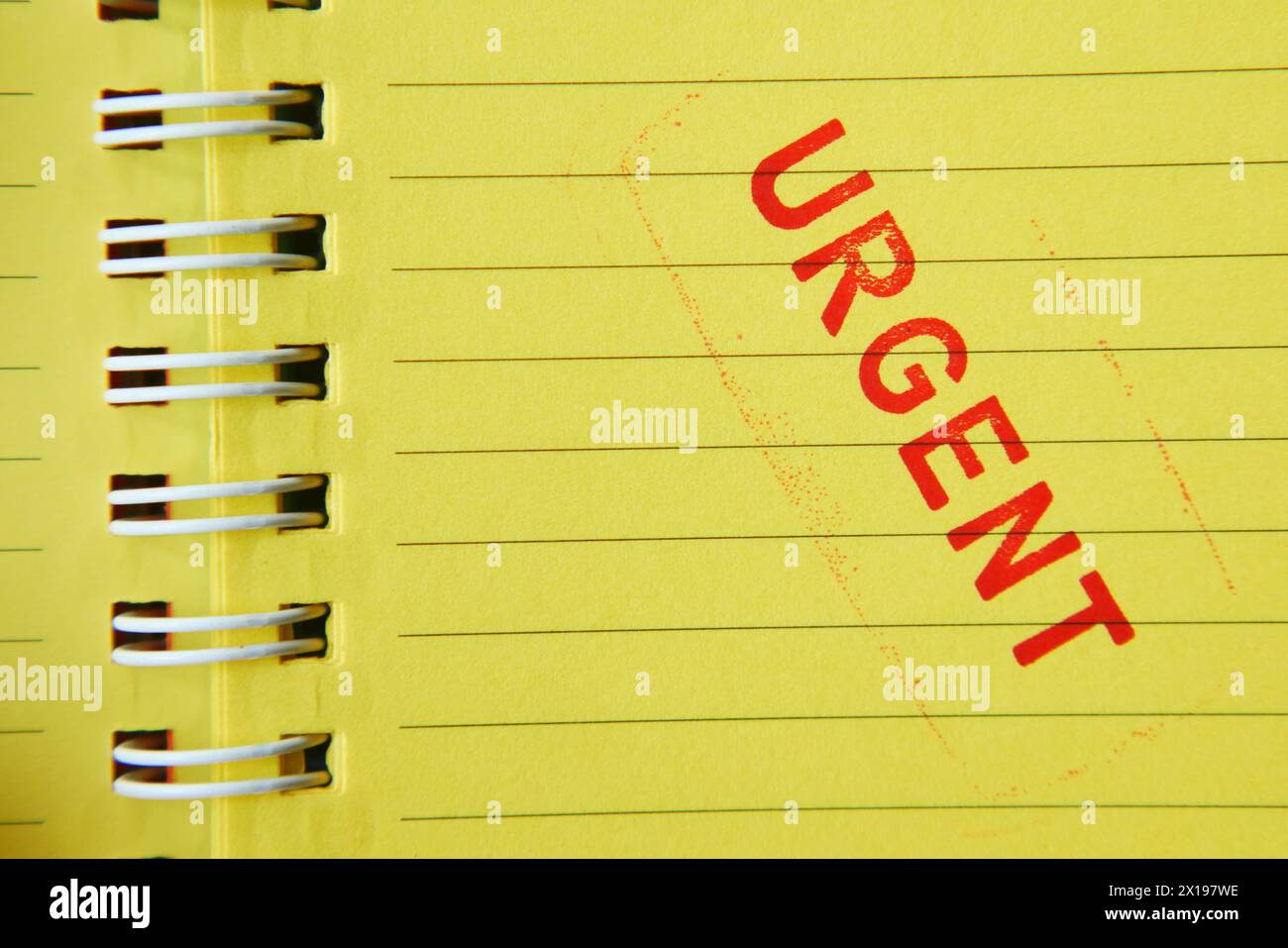 Red URGENT word stamp on a yellow paper Stock Photo - Alamy