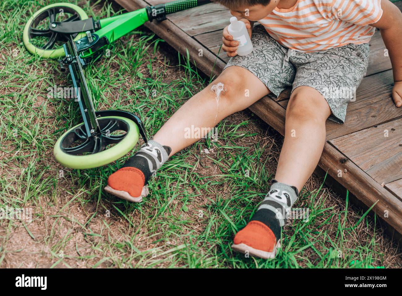 Brave Little Healer: A child focuses intently on applying a bandage to ...