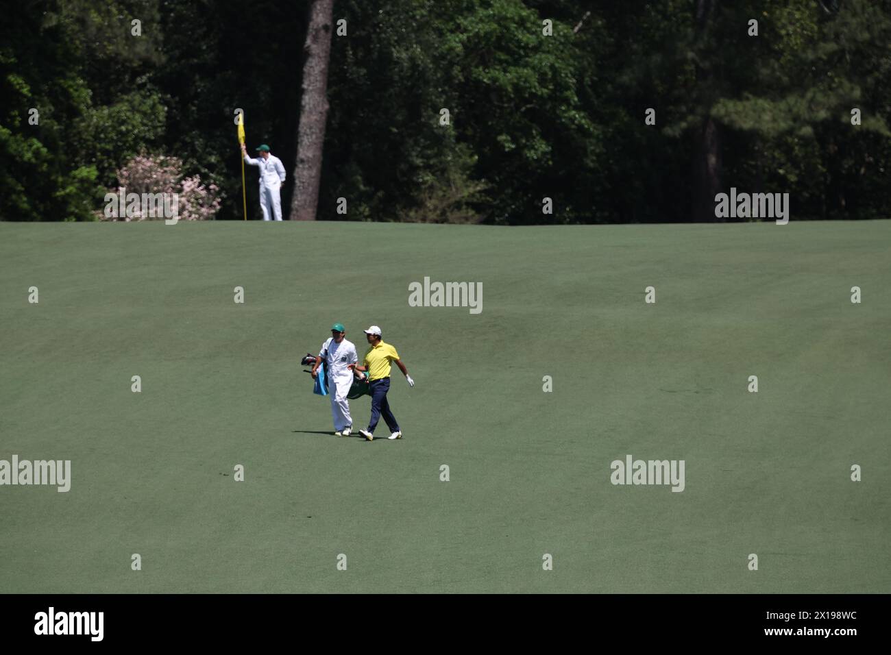 Japan's Hideki Matsuyama and his caddie Shota Hayafuji on the 2nd hole ...