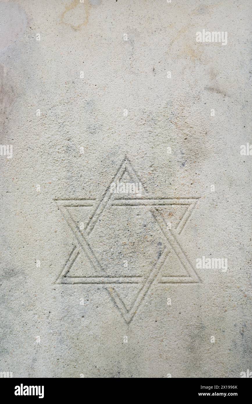 Star of David as a symbol of Judaism on a weathered gravestone with ...