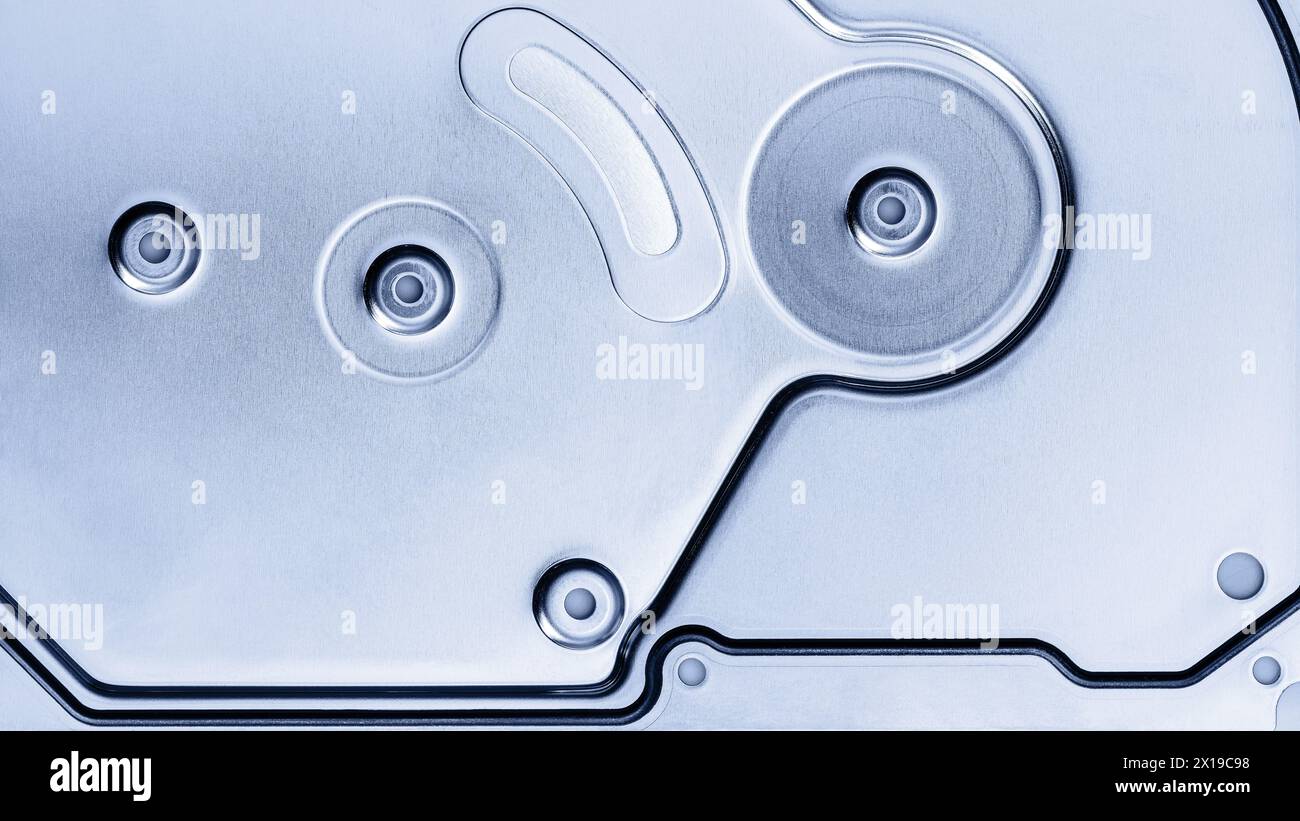 closeup view of hard drive lid. brushed metal texture. industrial ...