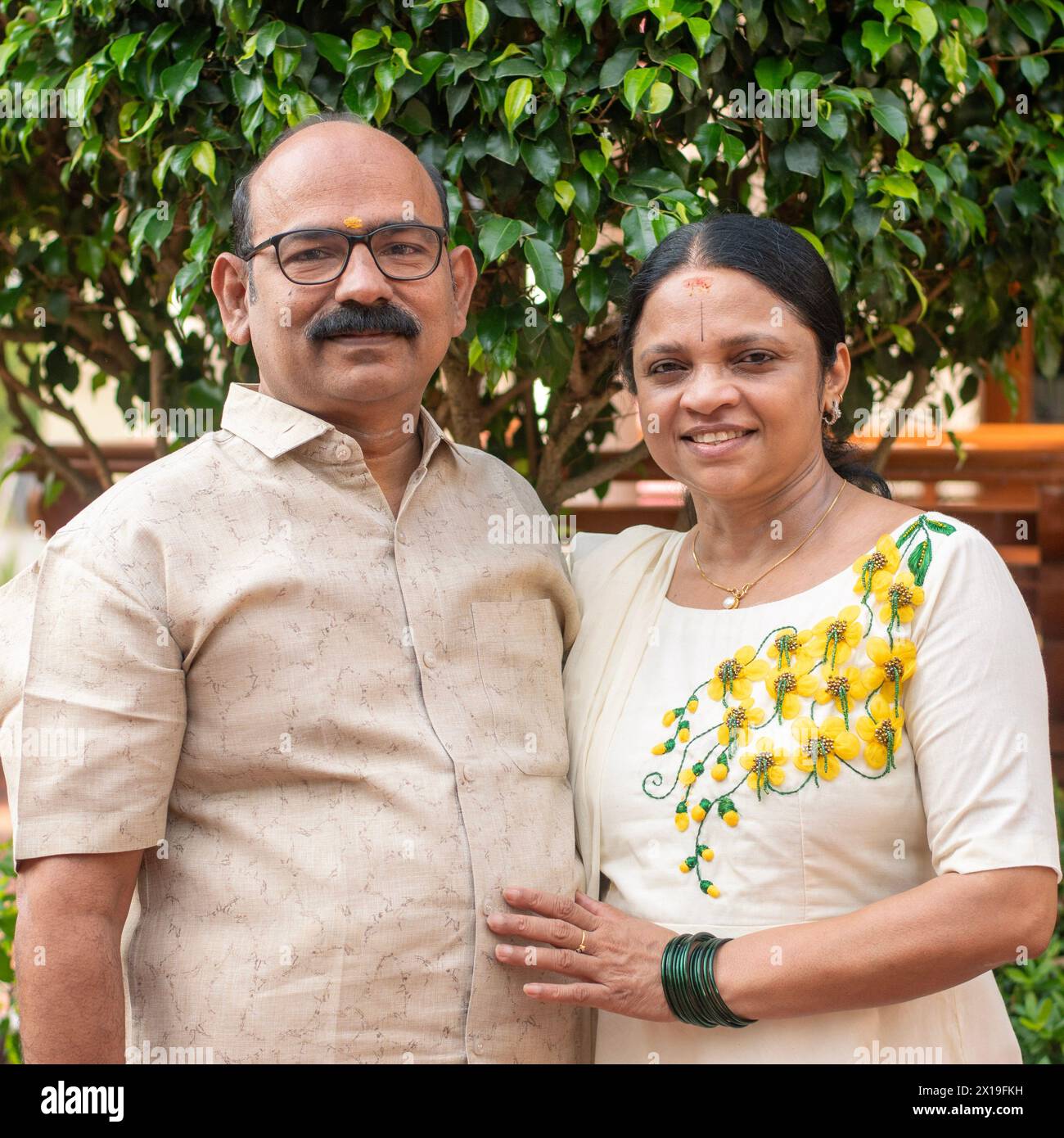 A Picture of middle aged malayali man and woman wearing a traditional ...