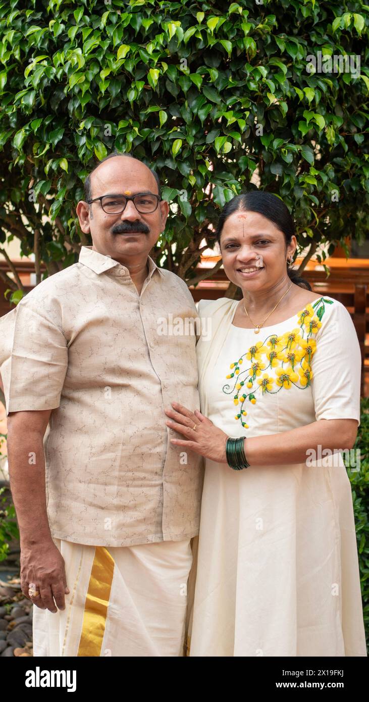 A Picture of middle aged malayali man and woman wearing a traditional ...