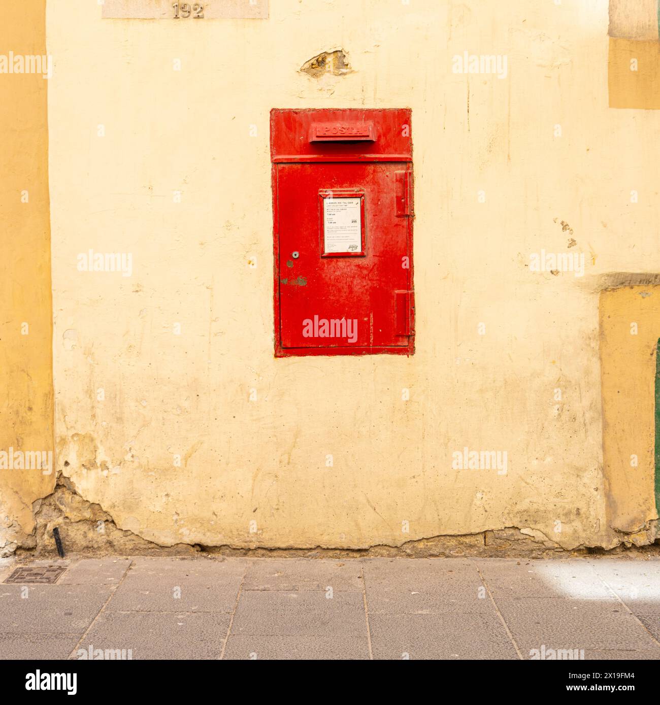 Valletta, Malta, April 03, 2024. Typical old red letterbox in a wall of ...