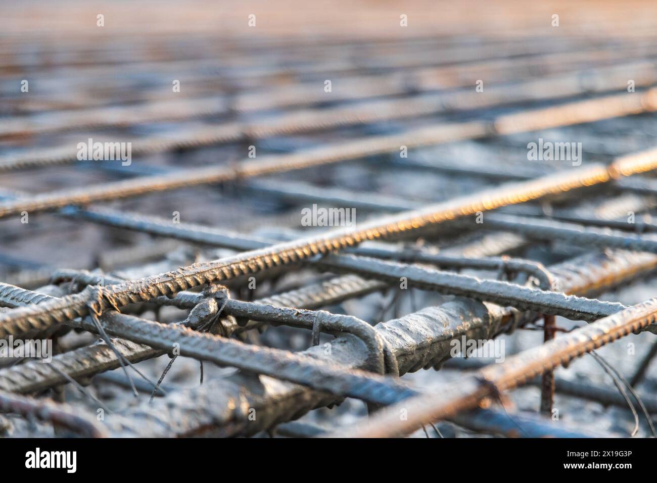 Pouring concrete for the reinforcement frame for the interfloor slab ...