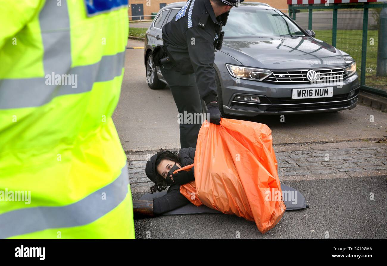 Sandwich, UK. 15th Apr, 2024. Police officers pull an activists legs ...