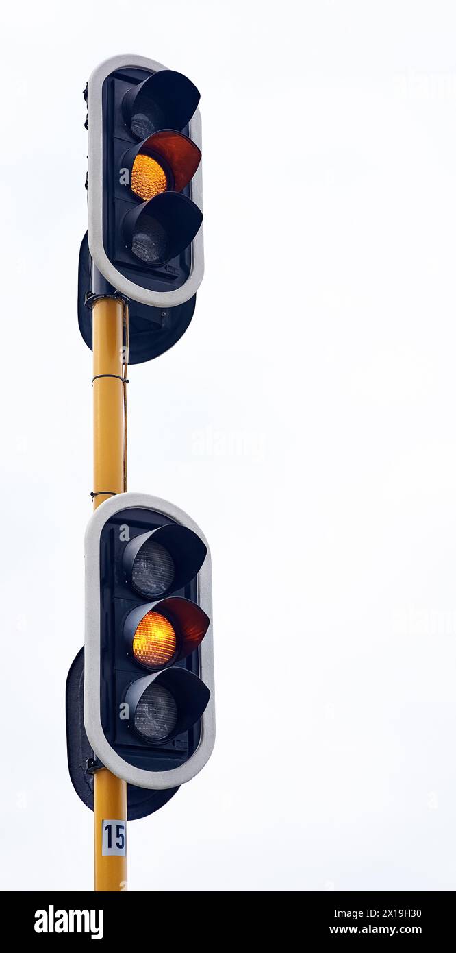 Traffic light, orange and street caution in city for slow down driving ...