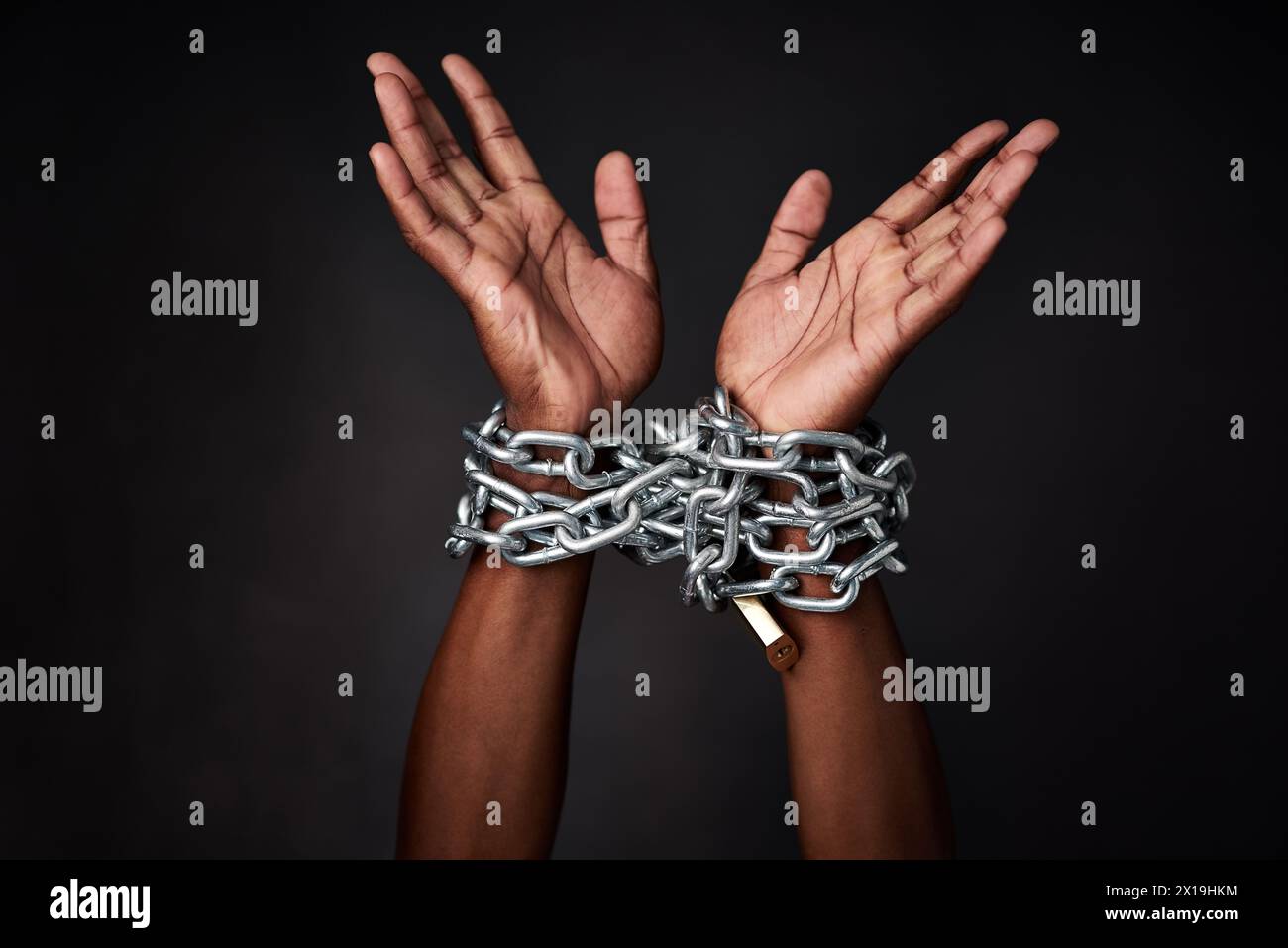 Studio, person and hands with lock on chain for crime, arrest and ...