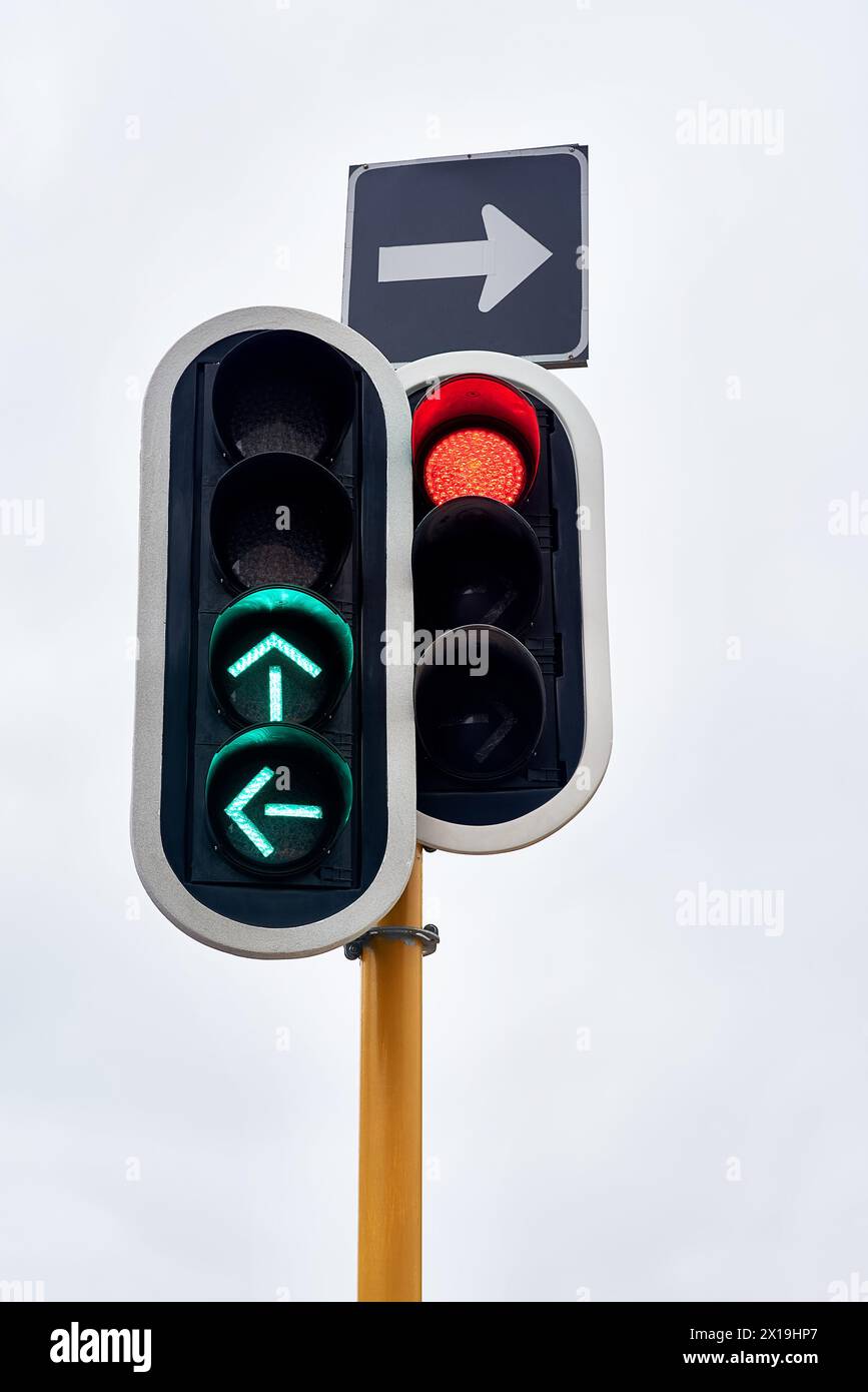 Traffic light, green and arrow with stop at street intersection for ...