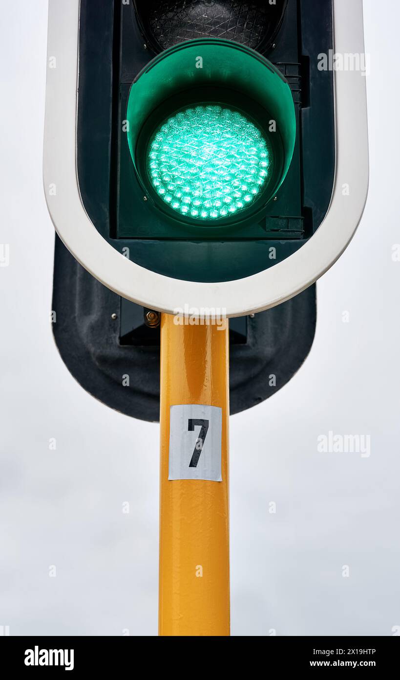 Green traffic light, city or outdoor sign for control, movement or ...