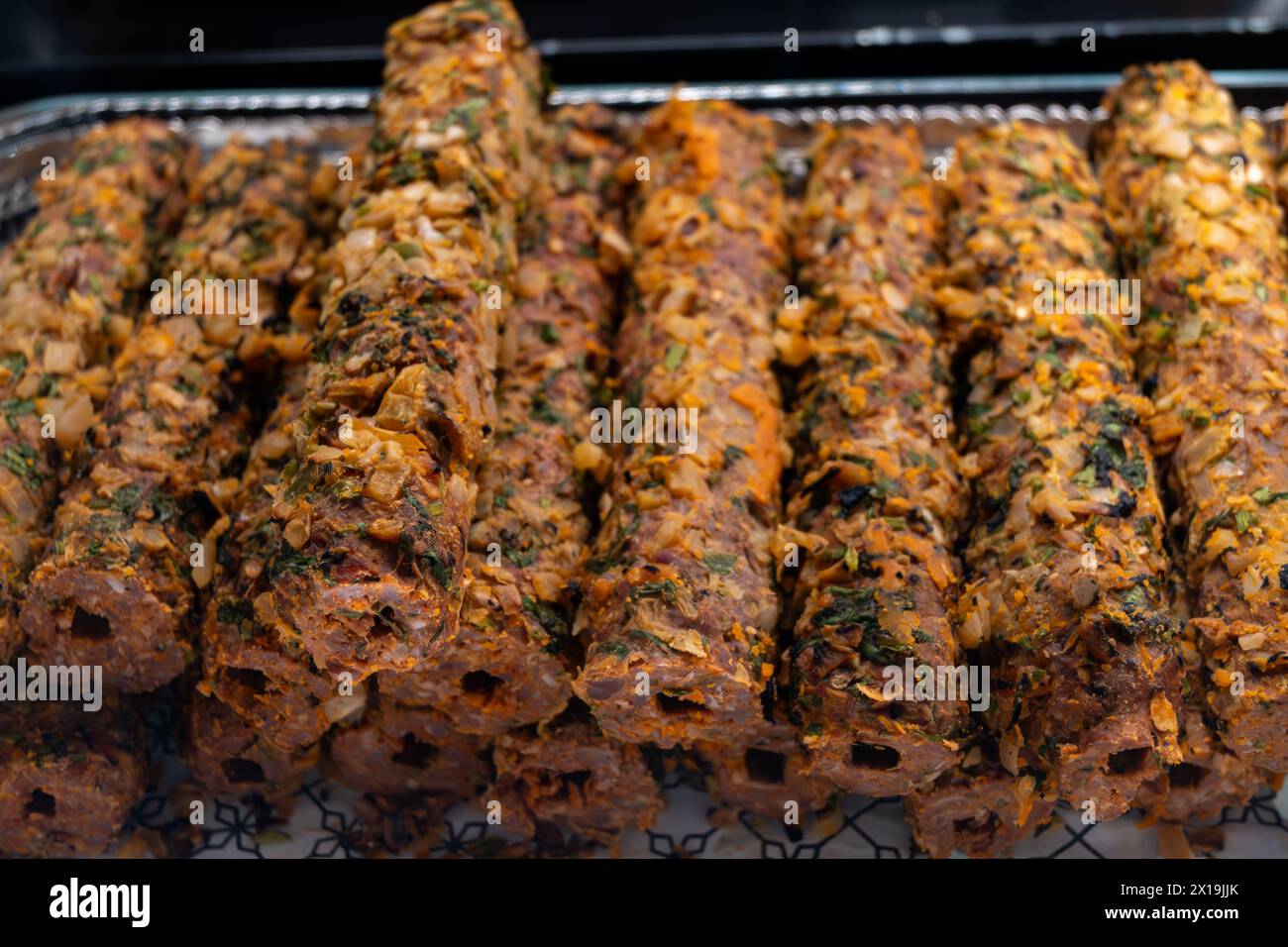 Lamb seekh kebabs meat food ready to cook on charcoal grill on display ...