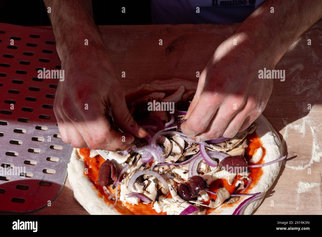 Making of fresh Italian pizza, street food court on Portobello road ...