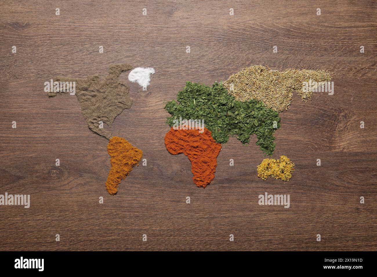World map of different spices on wooden table, flat lay Stock Photo - Alamy