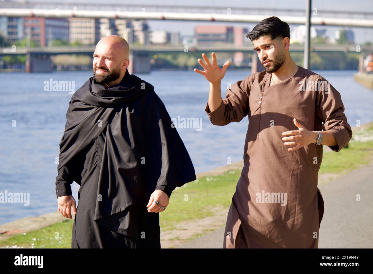 2024 two young afghani men walk past the river hi-res stock photography ...