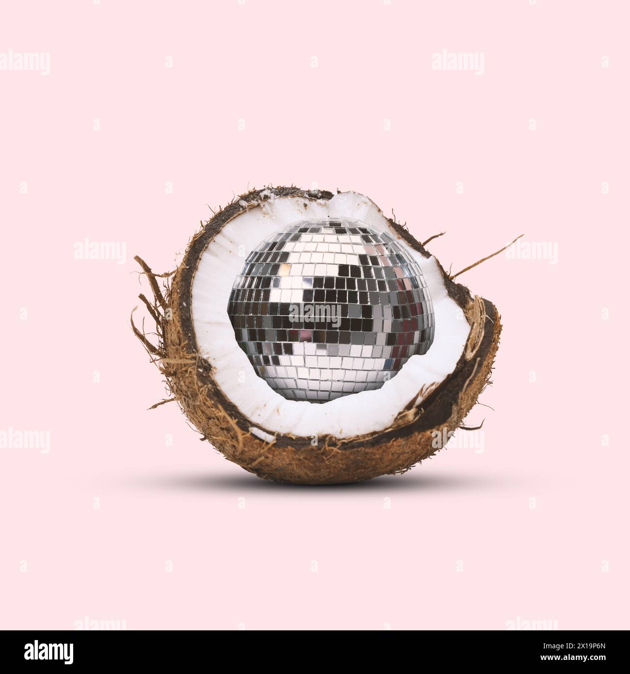 Contemporary art collage. Coconut with disco ball inside against pastel ...