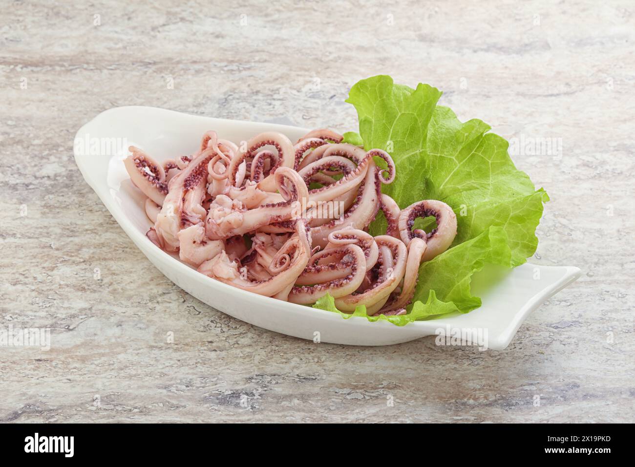 Marinated squid kalamri tentacles in the bowl Stock Photo - Alamy