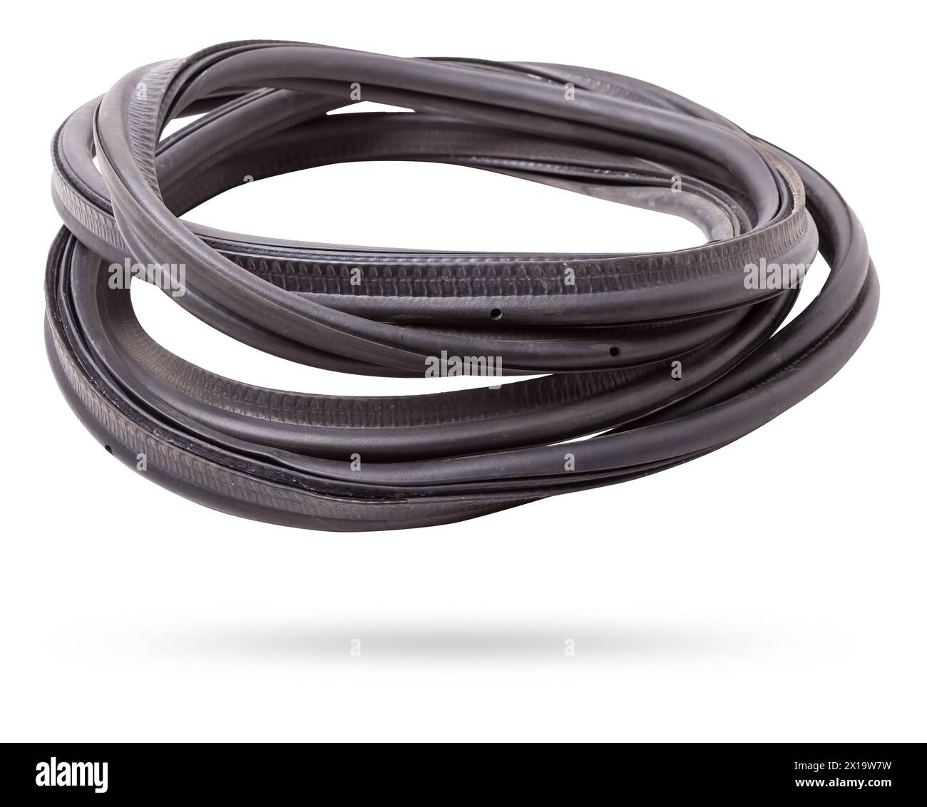 Rolled up black rubber sealant for elements of the car body, doors or ...