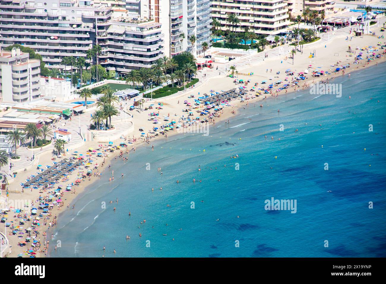 Views of buildings and beautiful turquoise water beaches in Benidorm ...