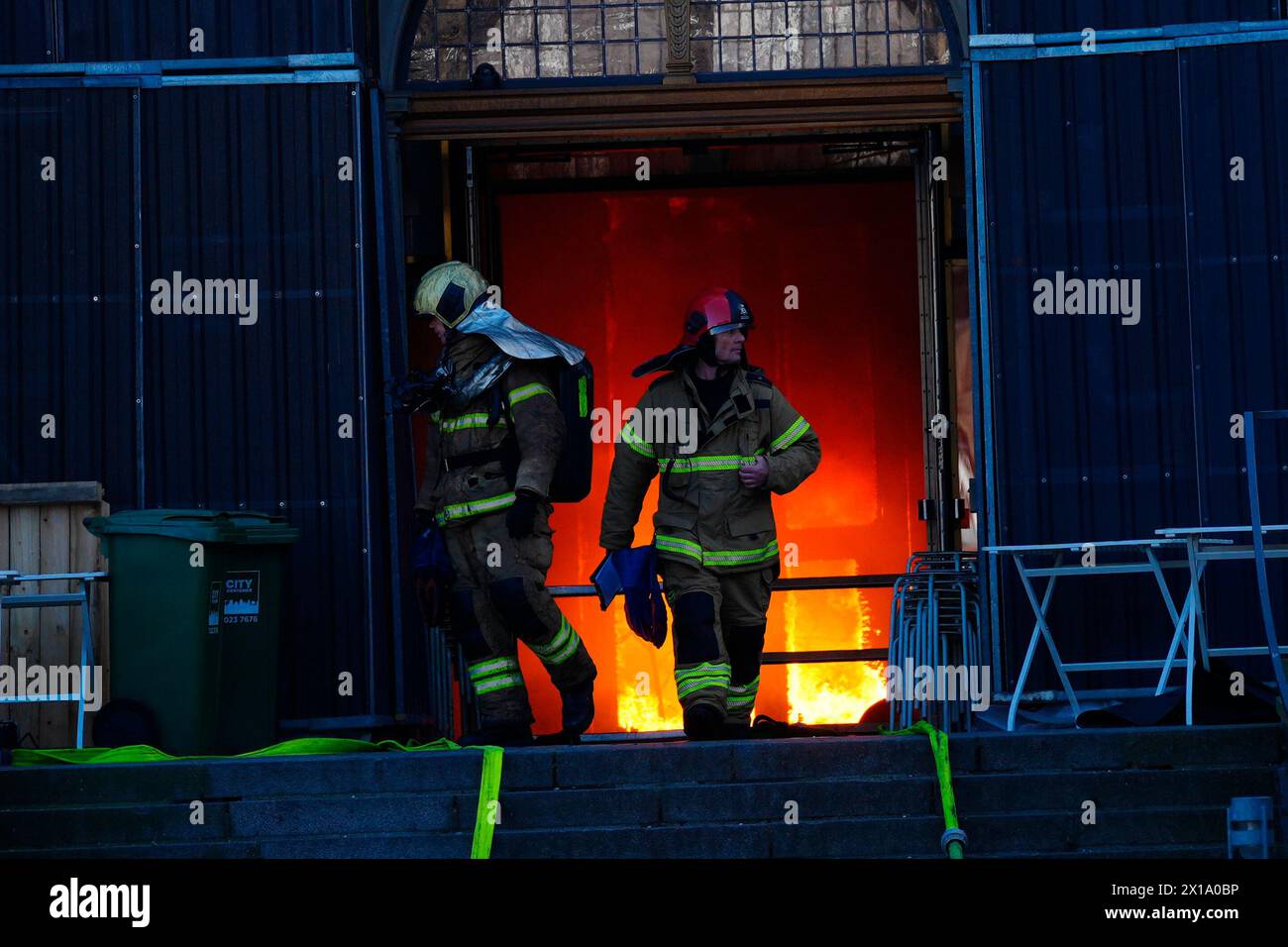 Copenhagen, Denmark. 16th Apr, 2024. Firefighters at the main entrance ...