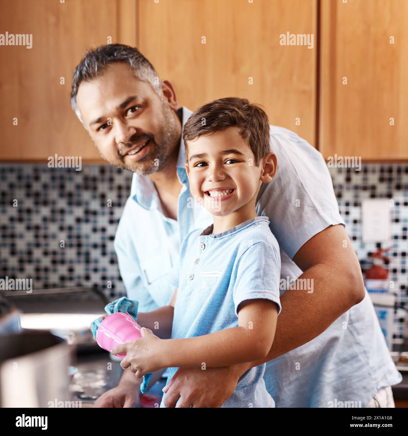 Kid, portrait and father washing dishes in kitchen together for ...