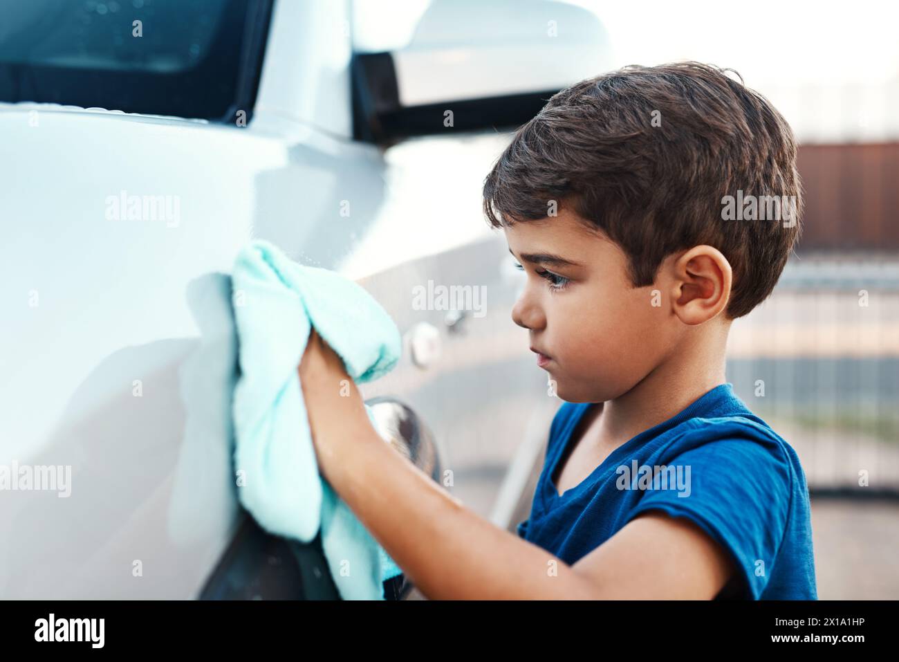 Boy helping with household chores hi-res stock photography and images ...
