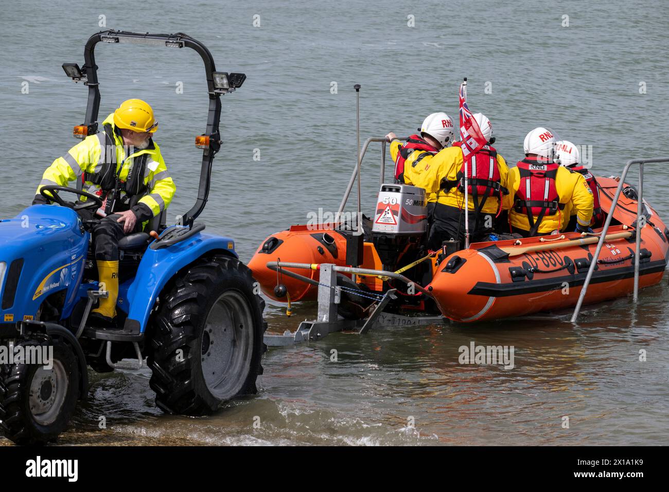 Rnli lifeboat with 4 person crew hi-res stock photography and images ...