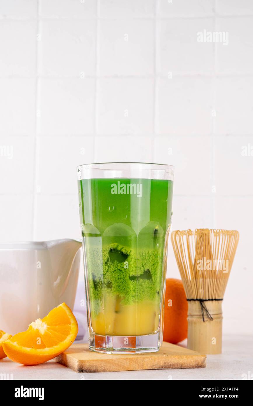 Orange Matcha Lemonade, Cold asia fruit cocktail with green matcha and ...