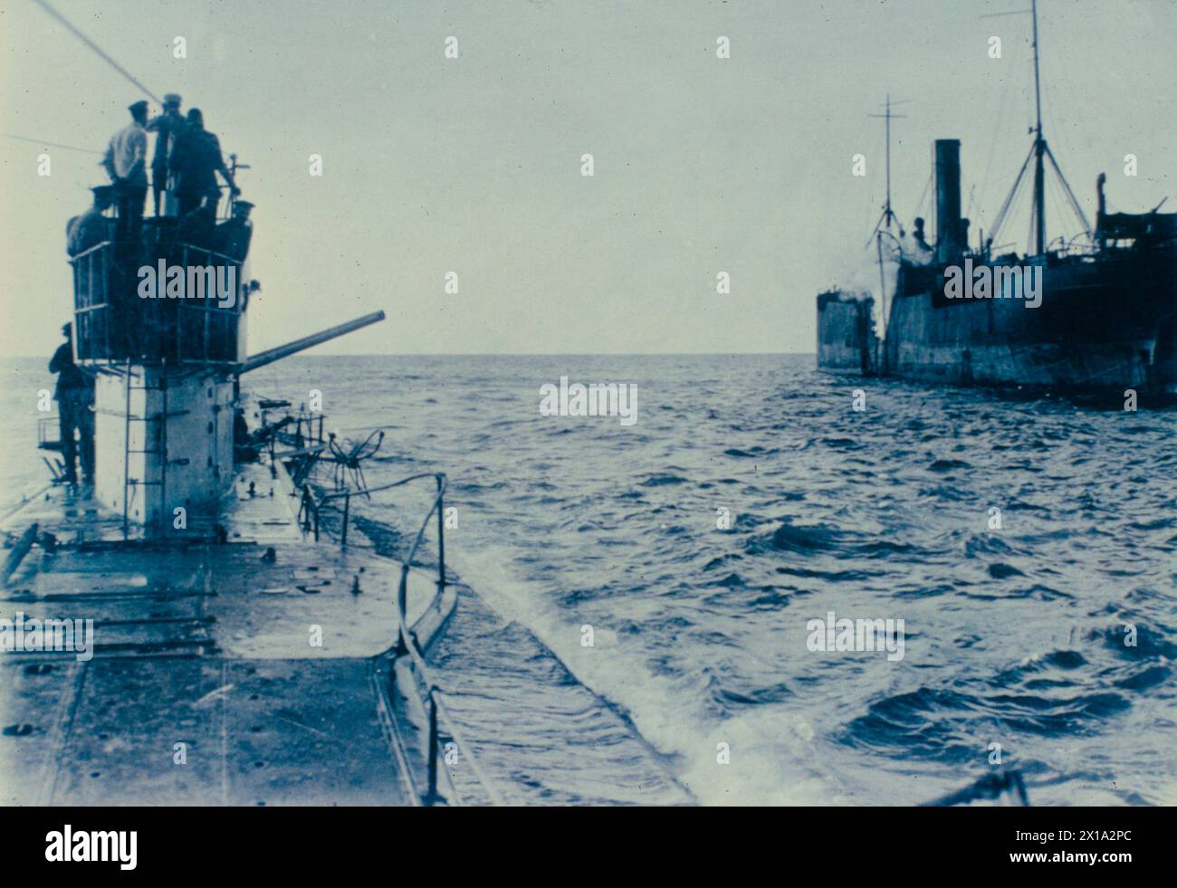 A German U-35 submarine surfaced alongside sinking English steamer ...