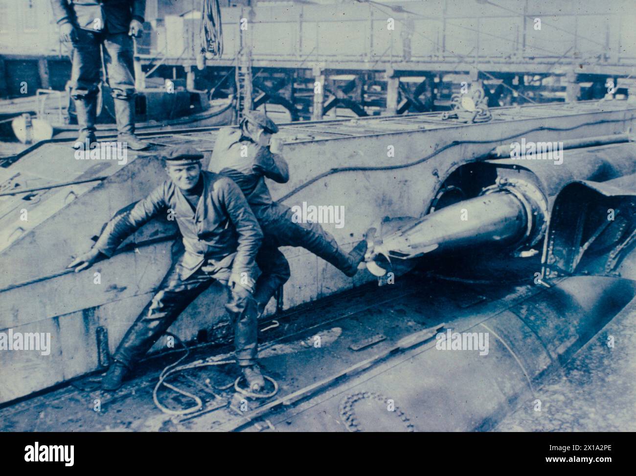 German sailors place torpedoes in tubes aboard a submarine, 1917 Stock ...