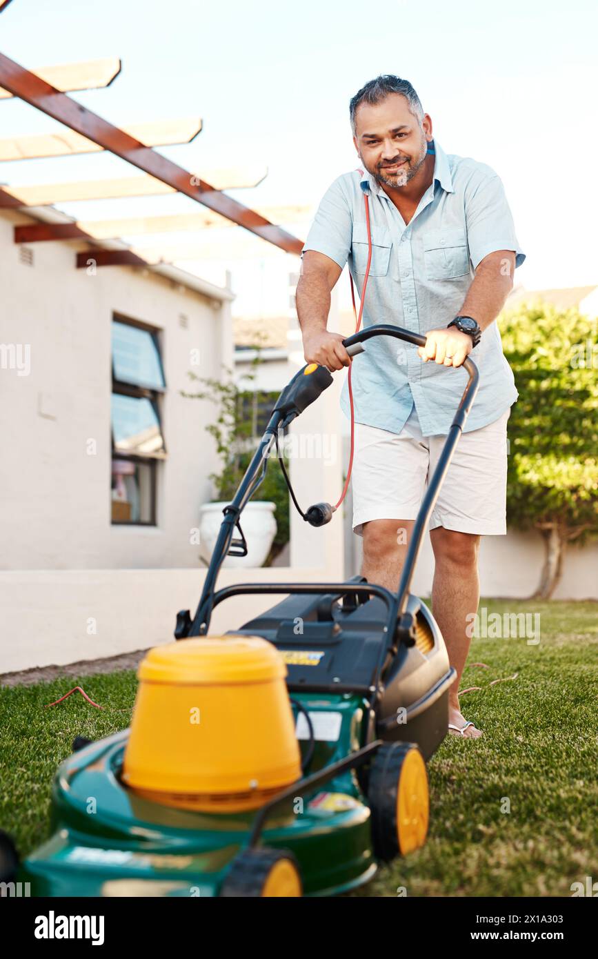 Grass, lawn mower and man in garden with smile for landscaping ...