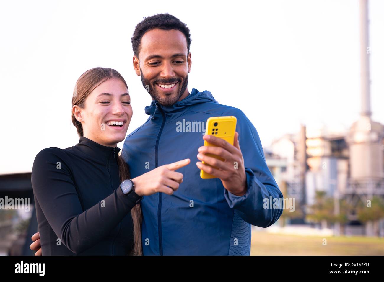 Young athletes using apps on the phone to keep track of their exercise ...