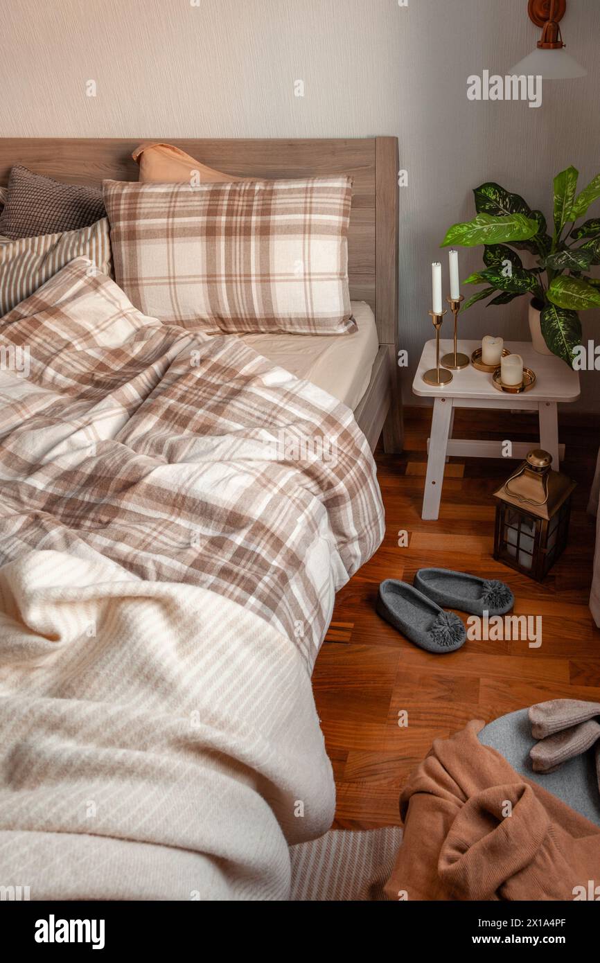 cozy scandinavian bedroom interior in natural tones, real life mess ...