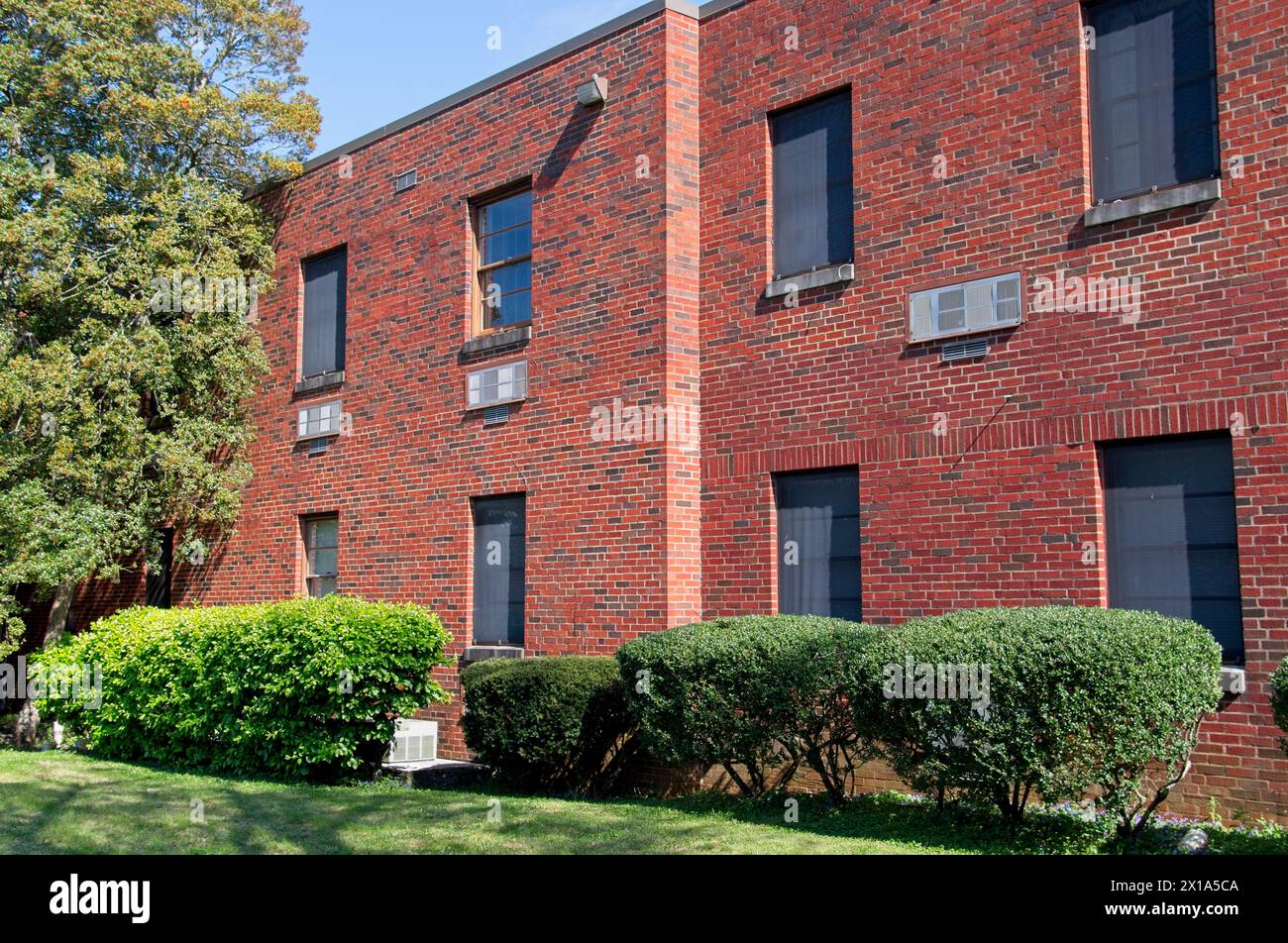 Brick exterior of building with windows and hvac units Stock Photo - Alamy