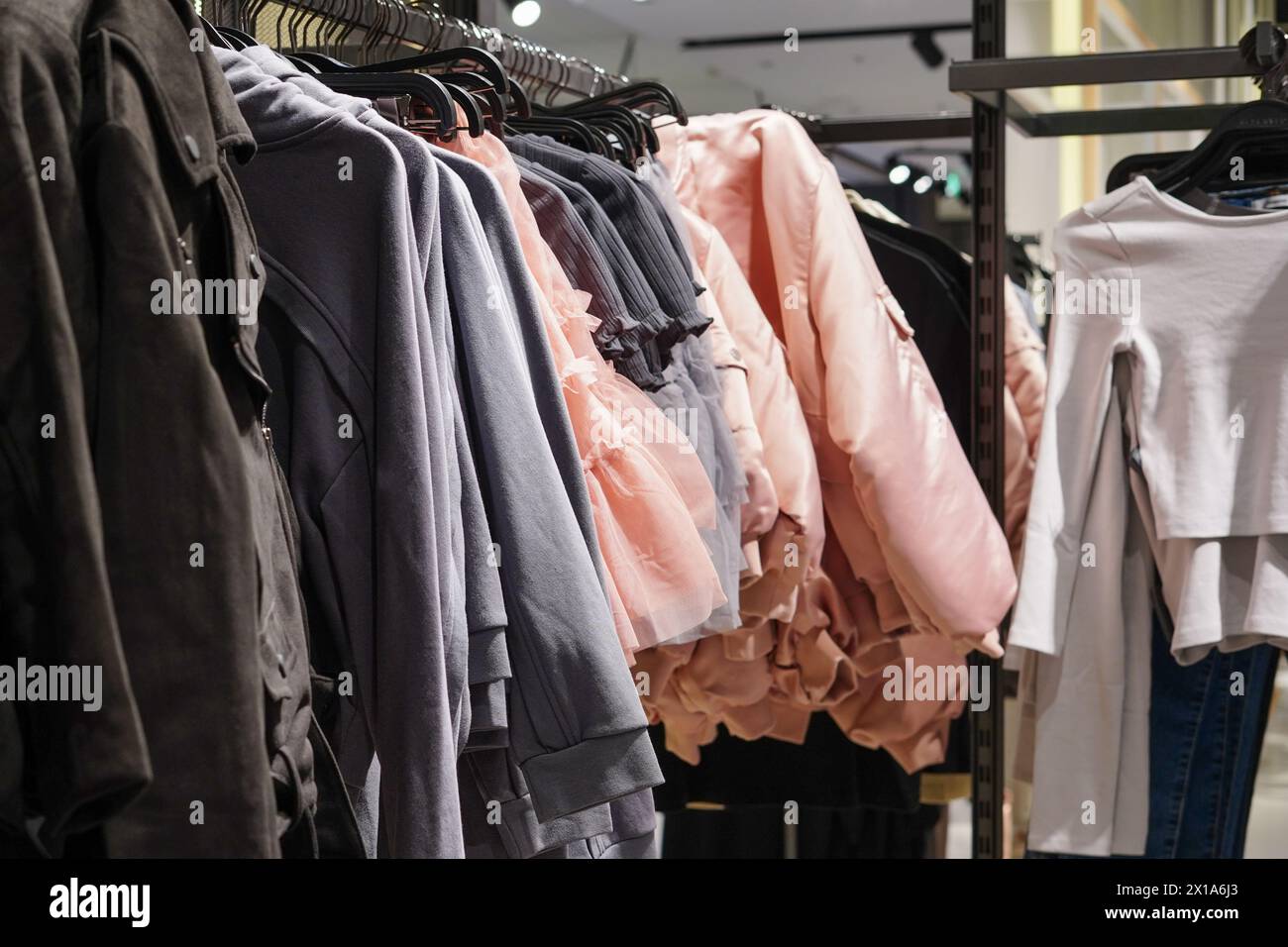 Clothes in a retail shop. Fashion and shopping concept Stock Photo - Alamy