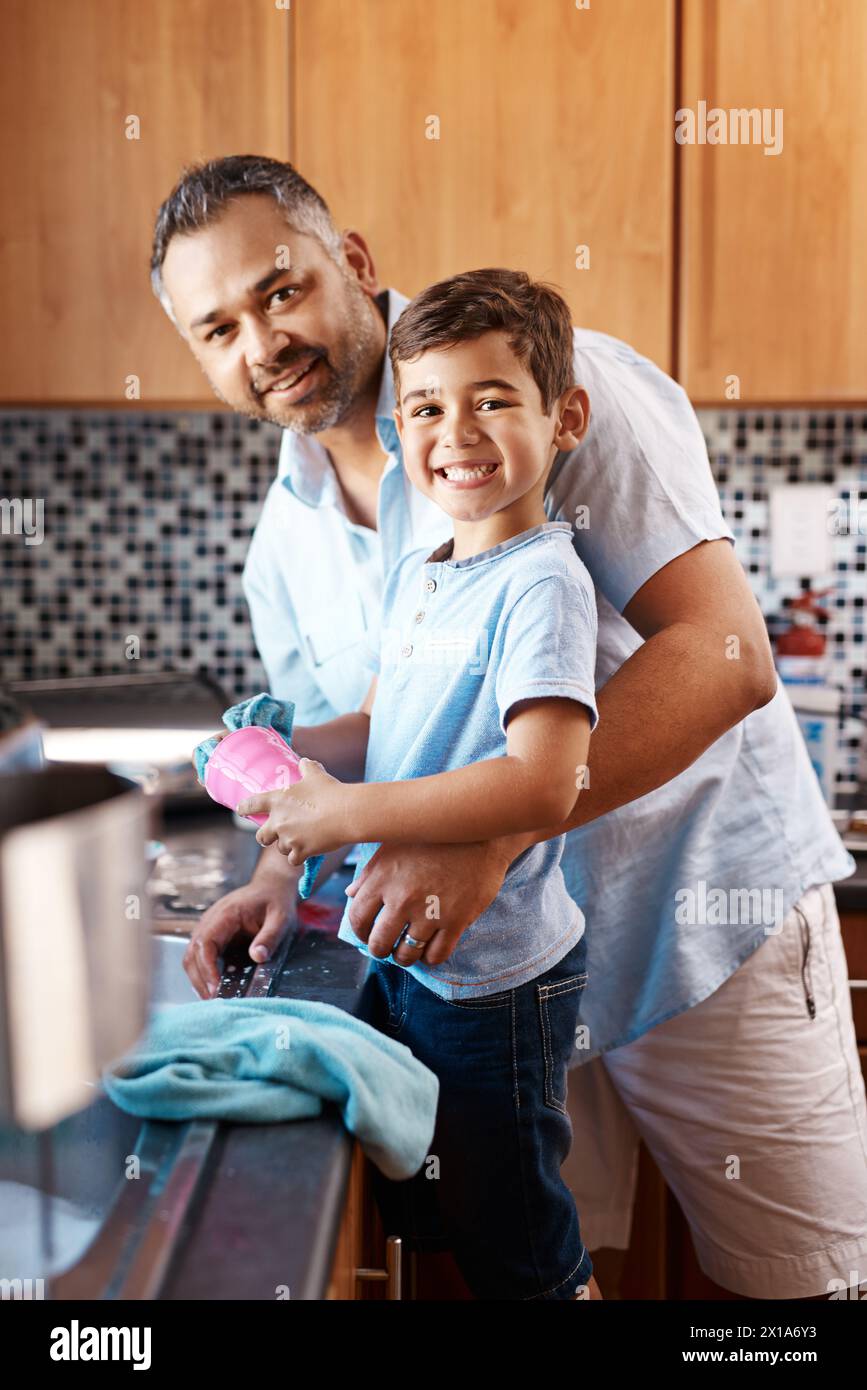 Child, portrait and dad washing dishes in kitchen together for learning ...