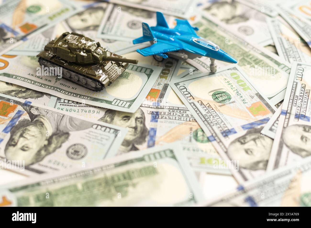 military fighter plane and dollars on a white background Stock Photo ...