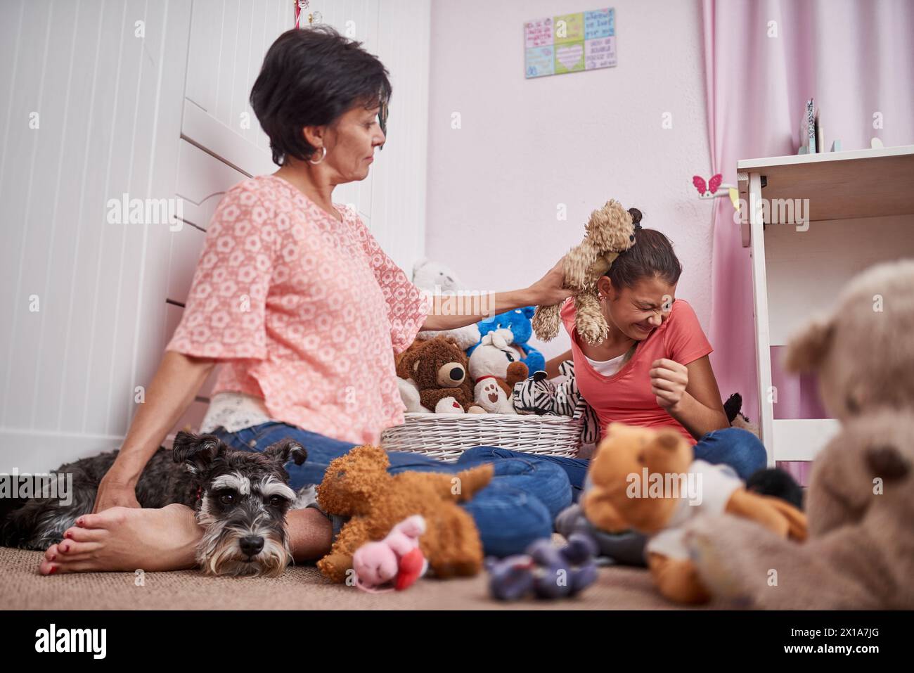 Mother, child and playing with teddy bear in home for bonding ...
