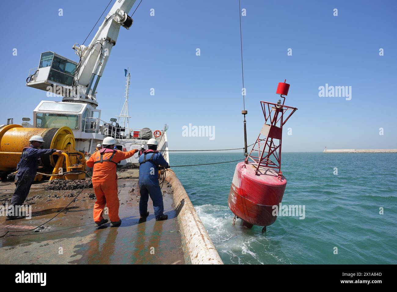 YANTAI, CHINA - APRIL 16, 2024 - A staff member of the "Haixun 153 ...