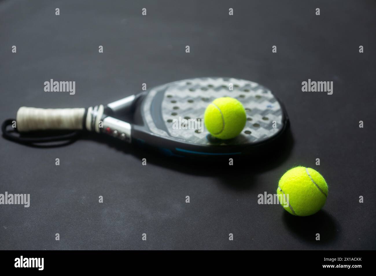 Isolated paddle tennis objects black background Stock Photo - Alamy