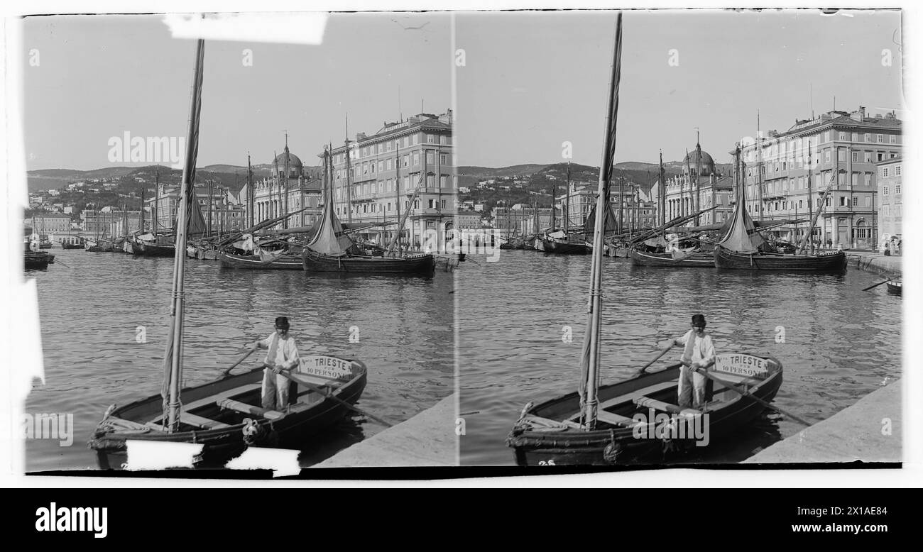 Harbour of Trieste, Austria-Hungary, standee oarsman in small boat with ...