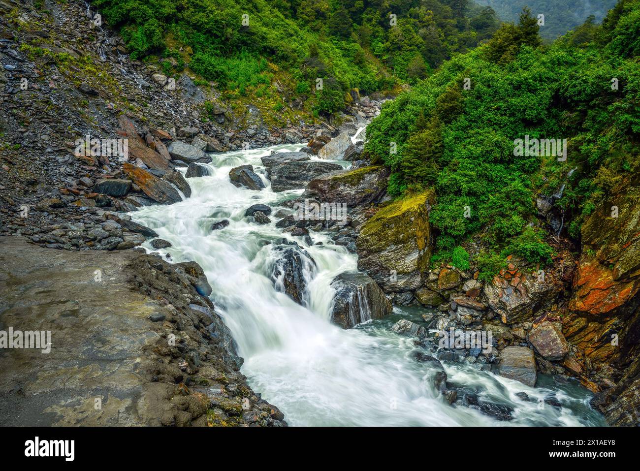 New Zealand alpine rivers in full flow. Taken at Haast Pass, linking ...